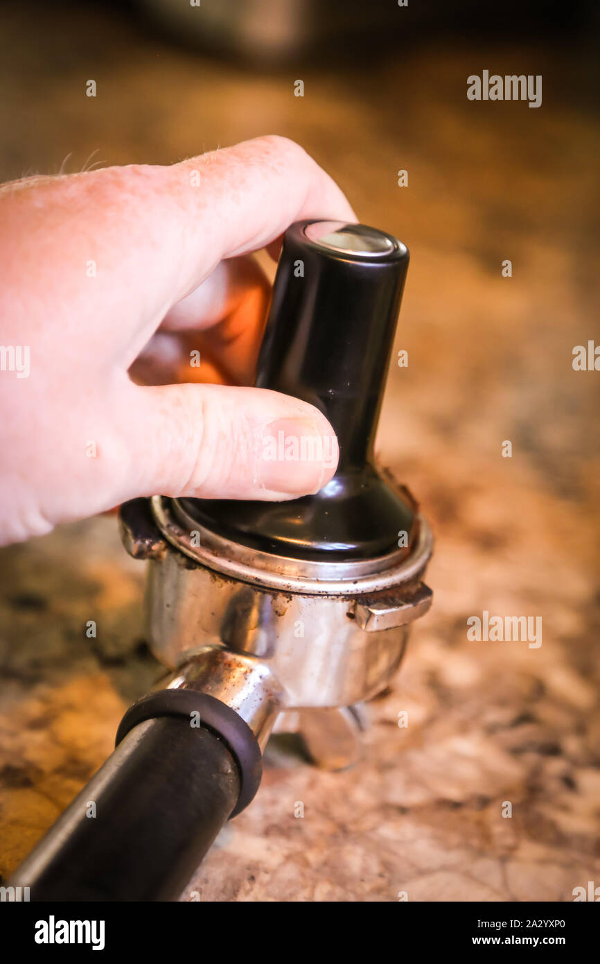 Coffee, or espresso making process - grinding and extracting coffee ...