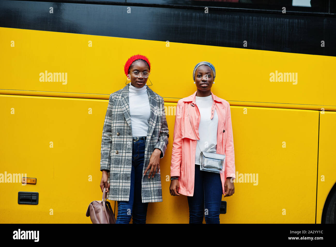 Two young modern fashionable, attractive, tall and slim african muslim ...