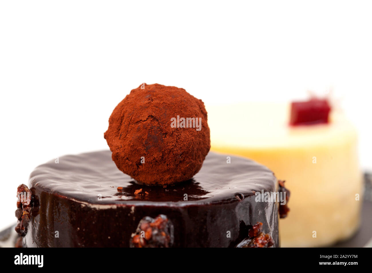 small individual mousse cake with mirror glaze isolated on white Stock ...