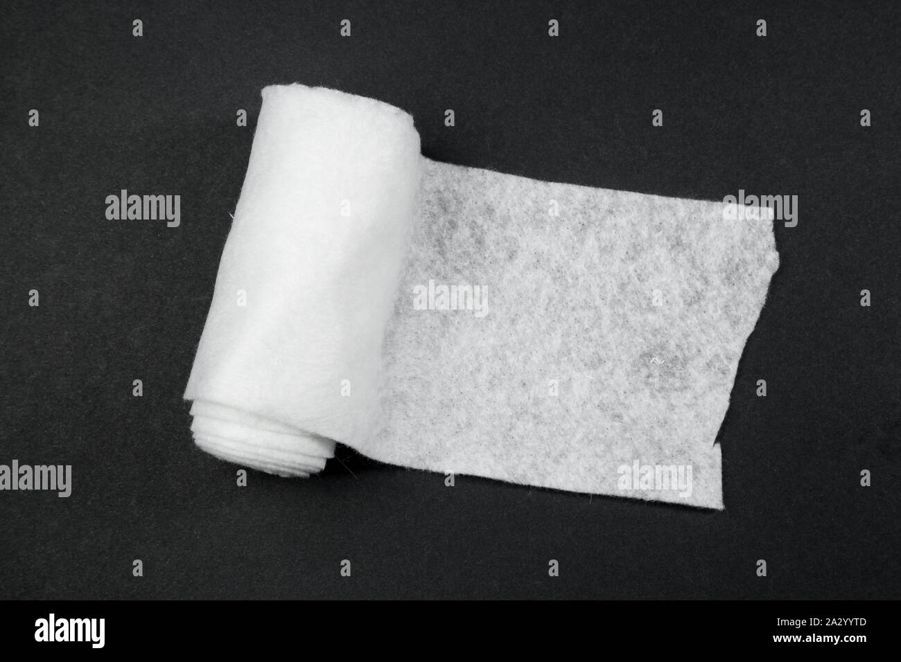 medical white bandage on black isolated background Stock Photo - Alamy
