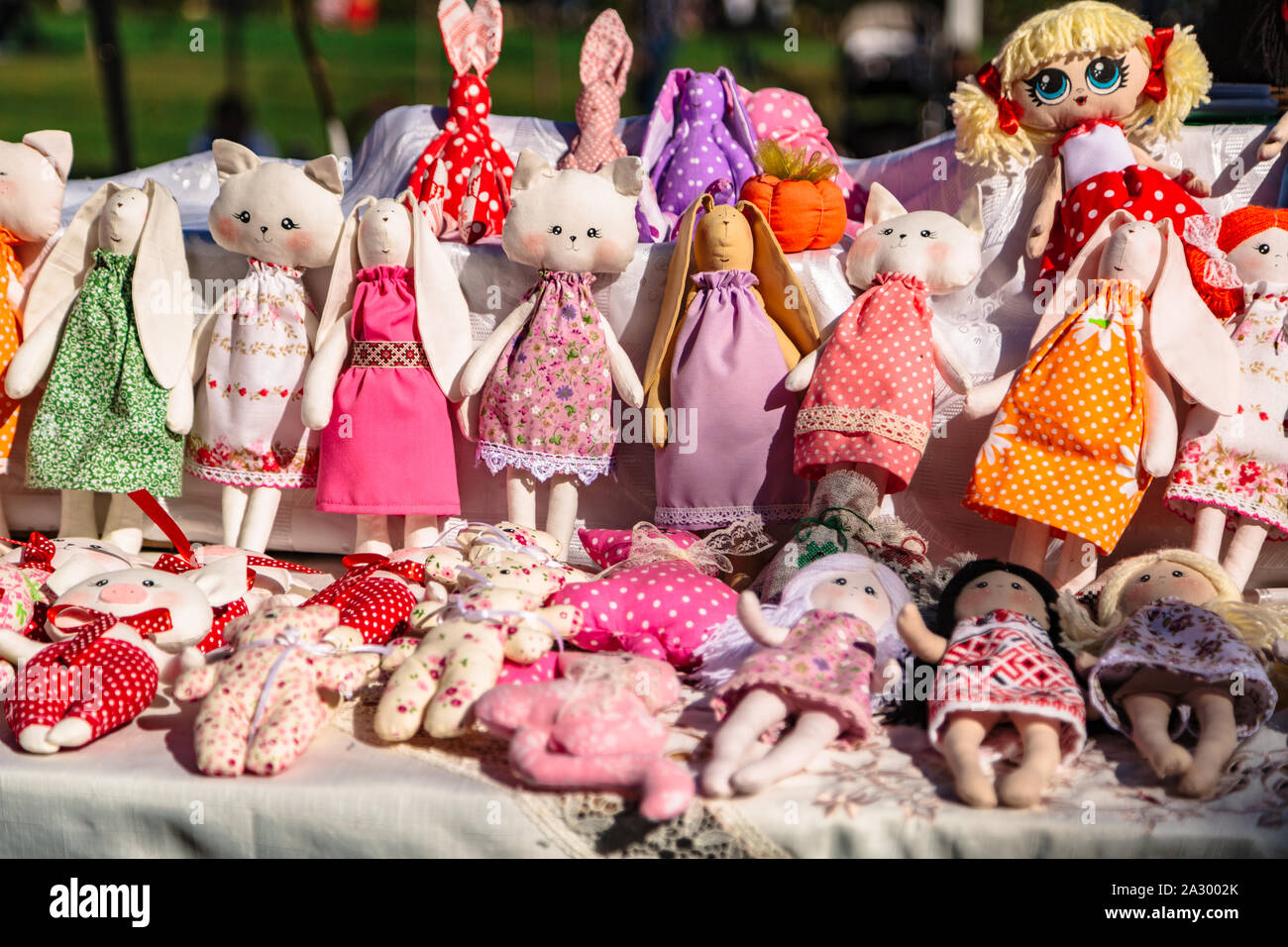 Large assortment of rag animal dolls on fall fair Stock Photo - Alamy