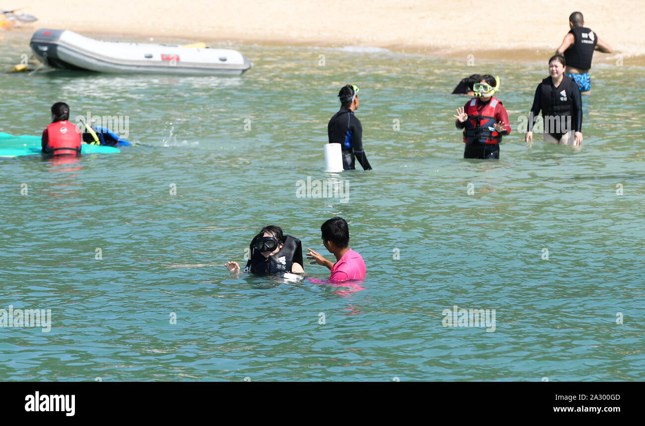 Lingshui, China's Hainan Province. 4th Oct, 2019. Visitors enjoy diving ...