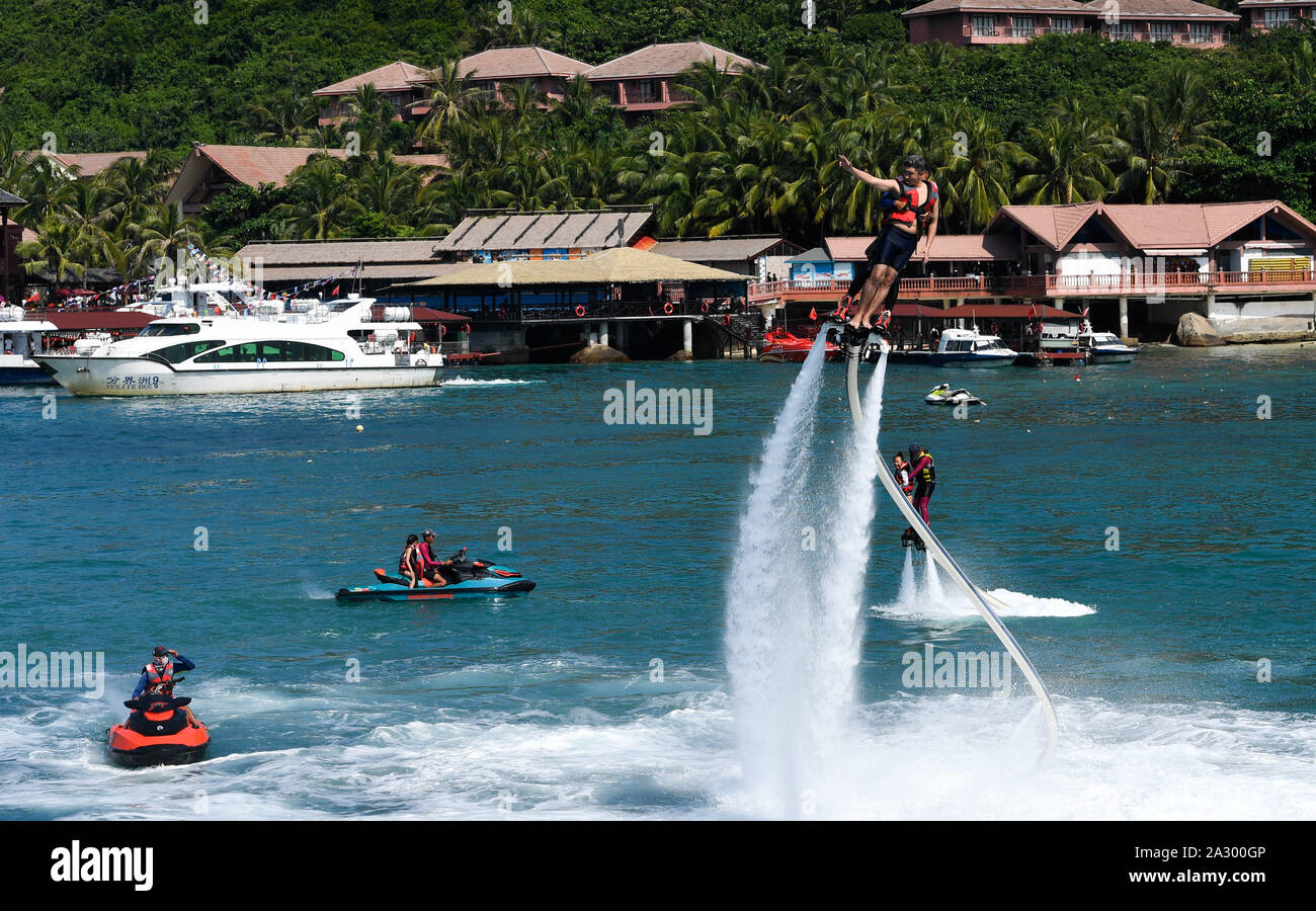 Lingshui, China's Hainan Province. 4th Oct, 2019. Visitors take part in ...
