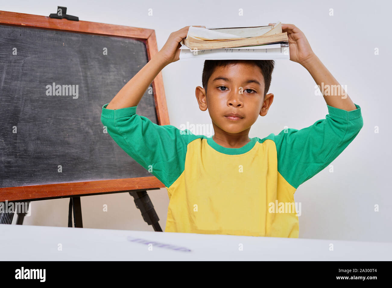 Bored boy doing homework hi-res stock photography and images - Alamy