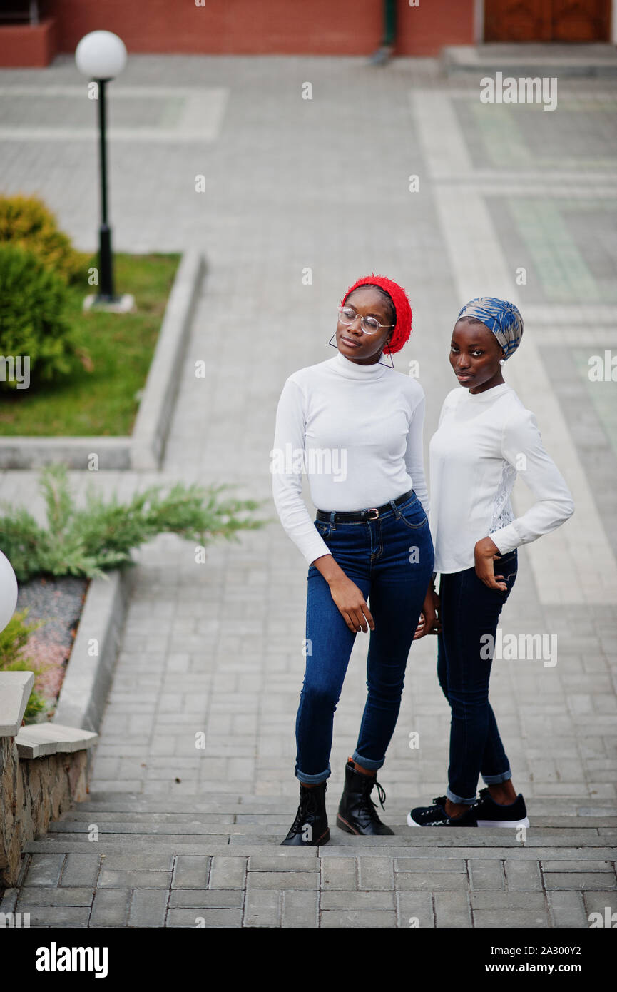 Two young modern fashionable, attractive, tall and slim african muslim ...
