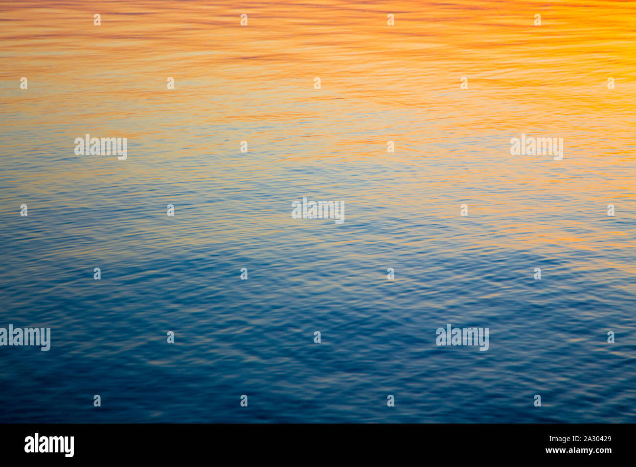 Clear water texture in blue and orange. Background of the ocean and the ...
