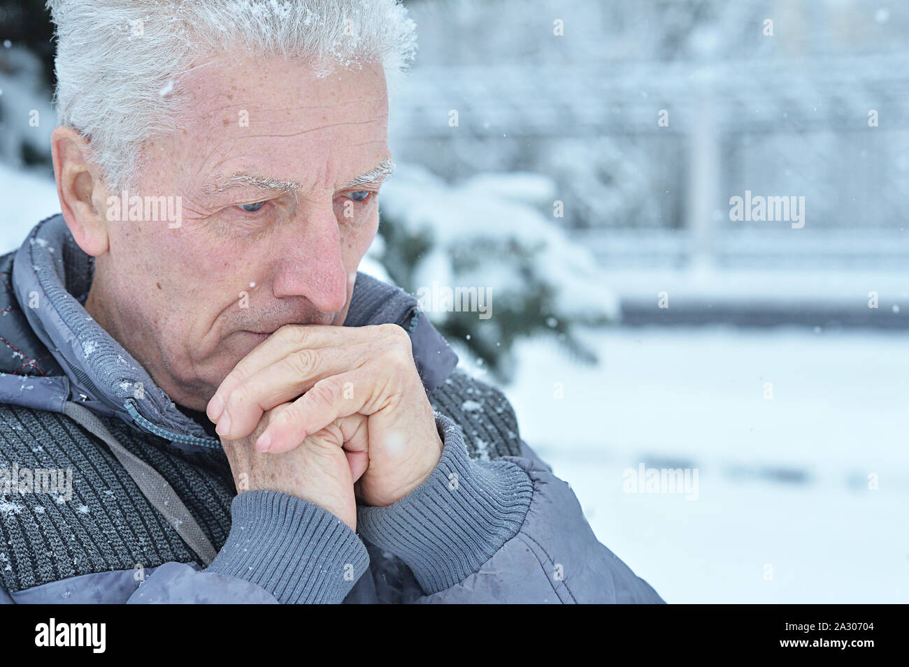 Sad senior man standing hi-res stock photography and images - Alamy
