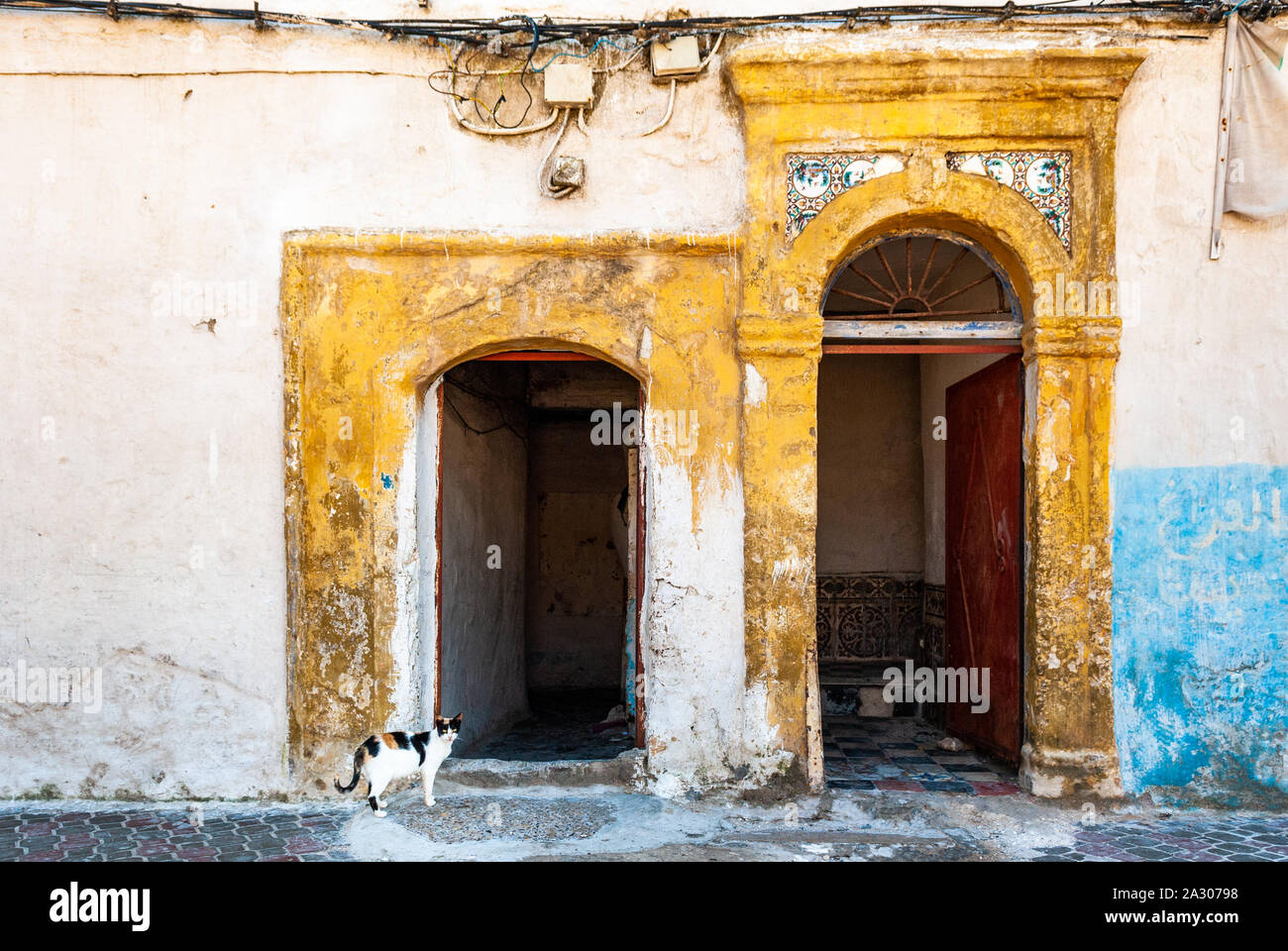 In the district of Mellah in Essaouira, Morocco. The yellow porch of an ...