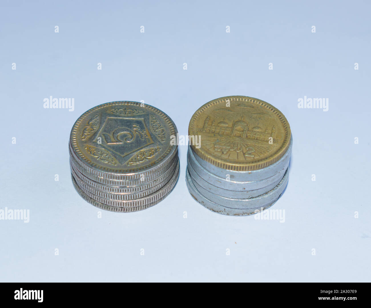 close up of pile of pakistani five rupee coins isolated on white ...
