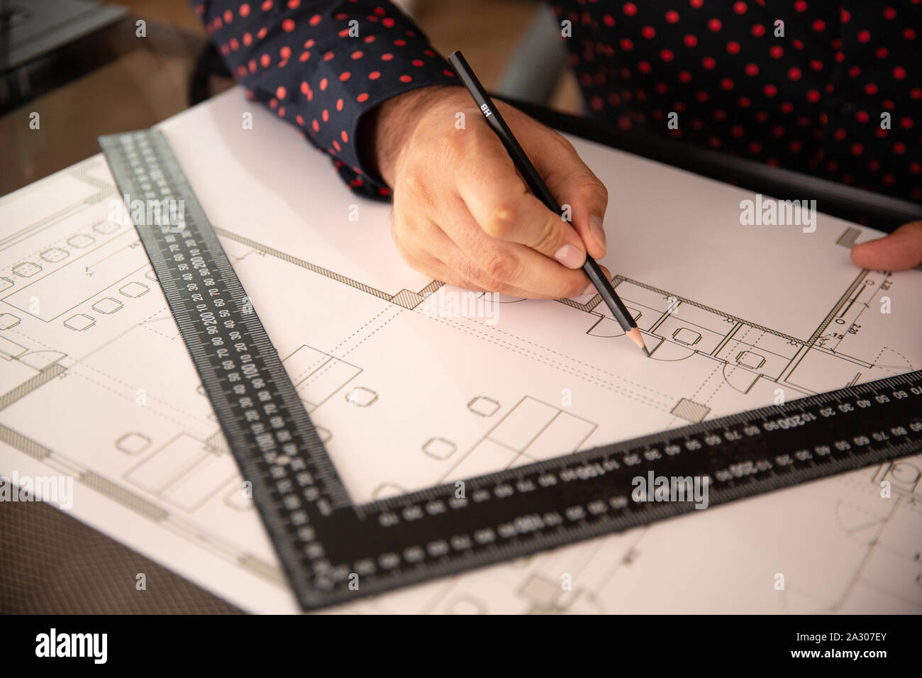 Close up with male architect drawing a new project on the sheet ...