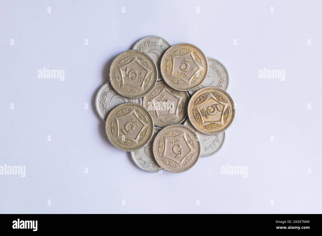 close up of pile of pakistani five rupee coins isolated on white ...