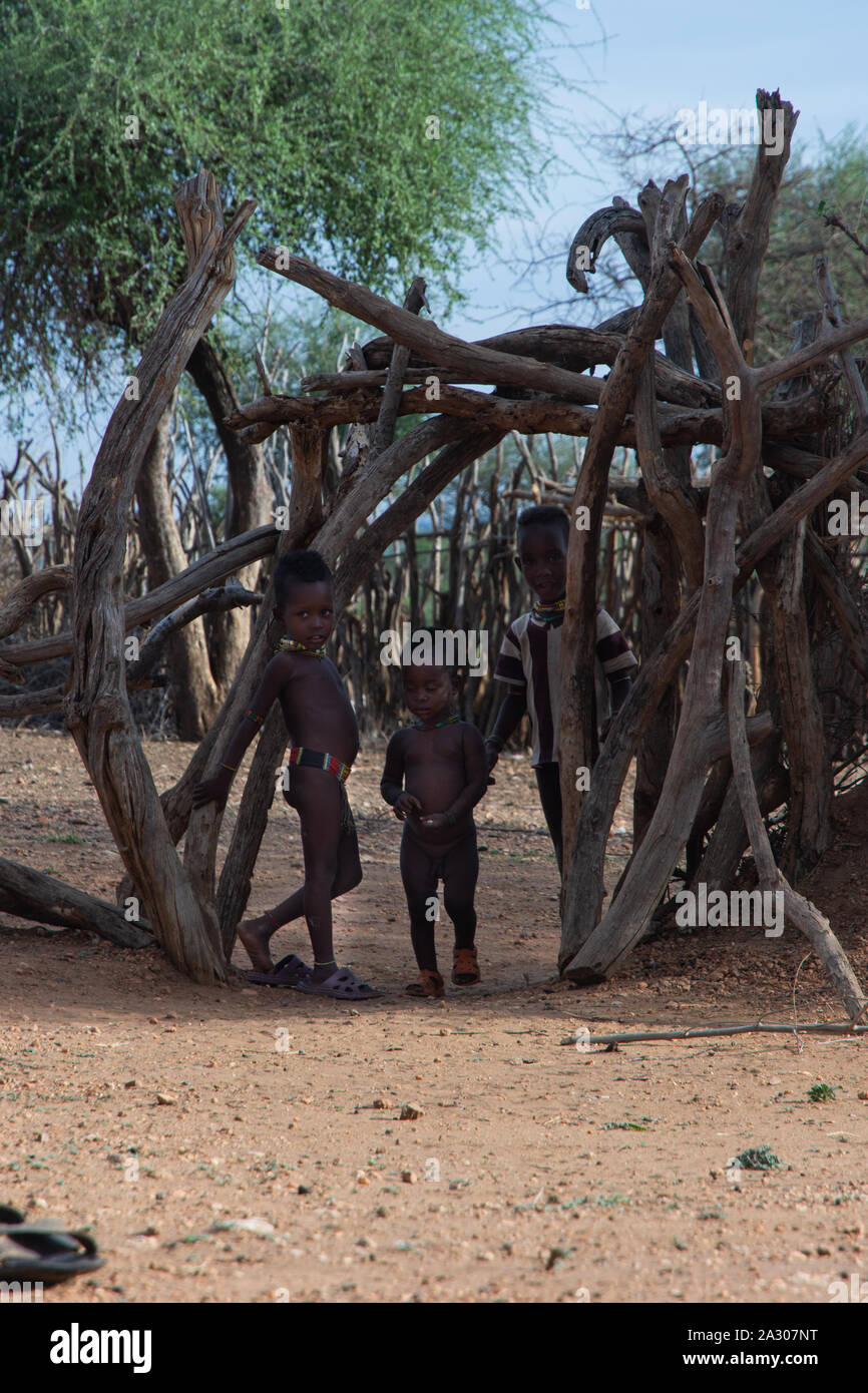 Turmi, Ethiopia - Nov 2018: Group of hamer tribe kids at the entrance ...