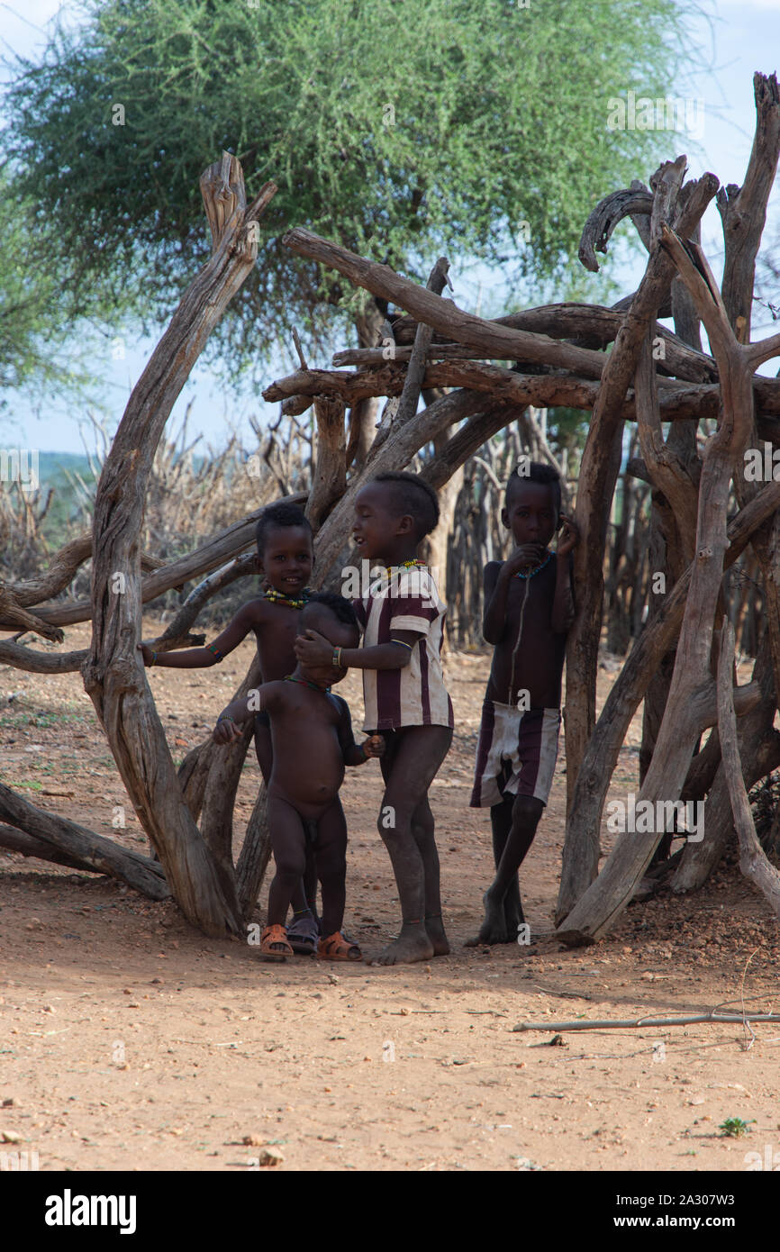 Turmi, Ethiopia - Nov 2018: Group of hamer tribe kids at the entrance ...