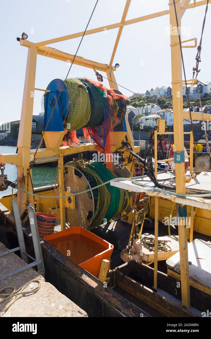 Trawl nets wound up on net drums a wide powered spool on the stern of a ...