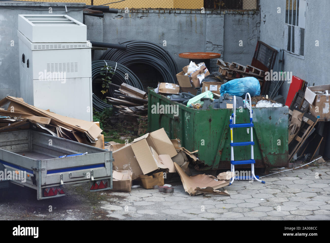 Dumpsters being full with garbage Stock Photo - Alamy
