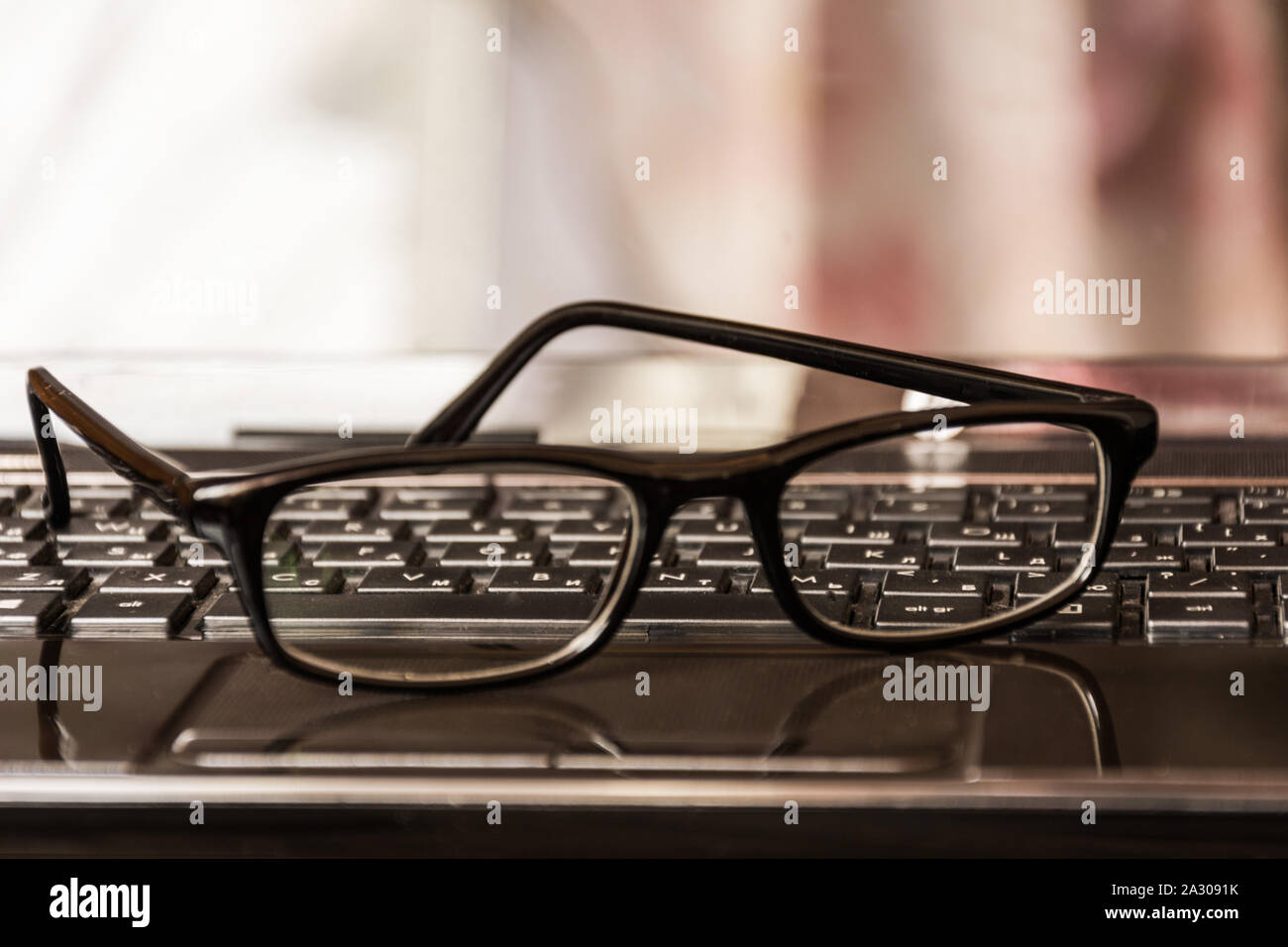 Keyboard and eyeglasses. Protect vision concept Stock Photo - Alamy