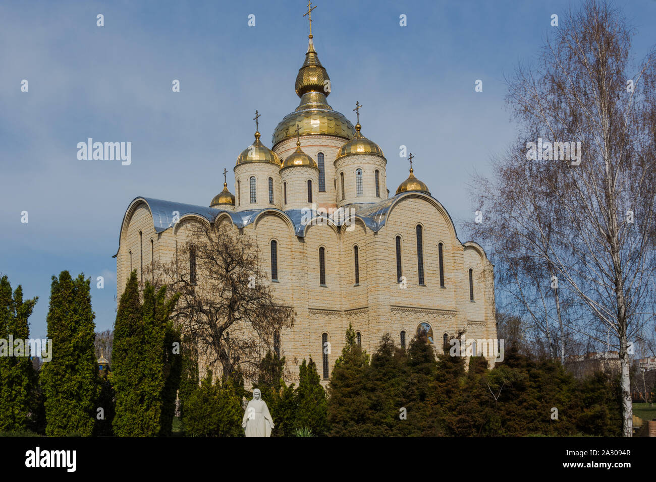 Church and trees on the blue sky background. Culture an religion ...