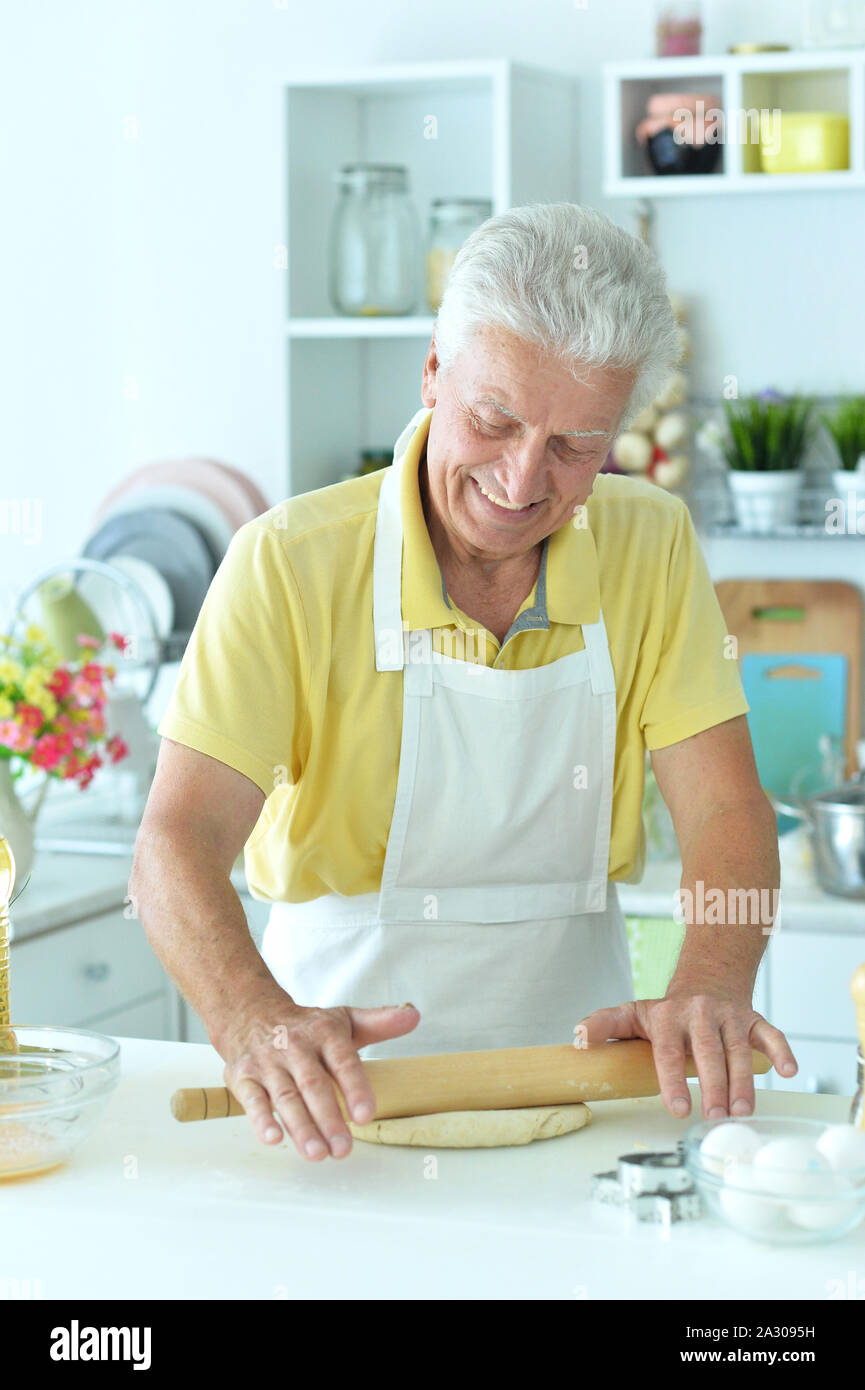 Man baking elderly hi-res stock photography and images - Alamy