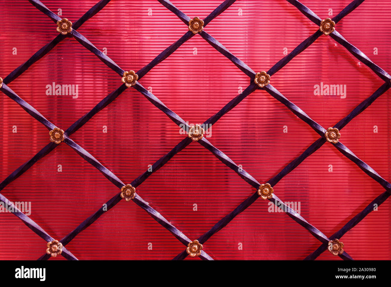 Red plastic fence texture decorated with steel stripes and small gold ...