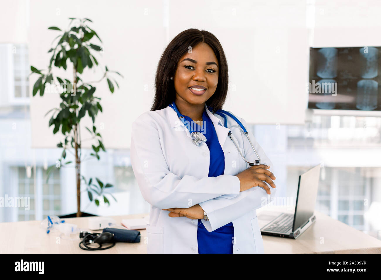 Portrait Of Female Doctor In Doctor's Office. Successful African woman ...