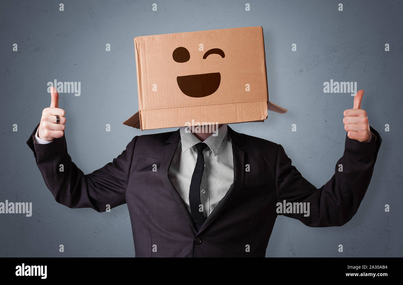 Funny man wearing cardboard box on his head with smiley face Stock ...