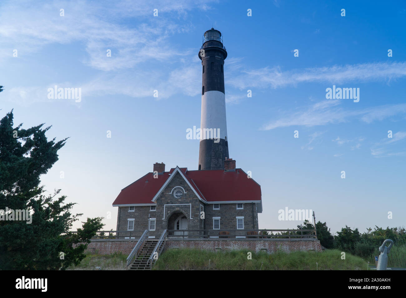 Wide establishing shot of generic lighthouse during the day time ...