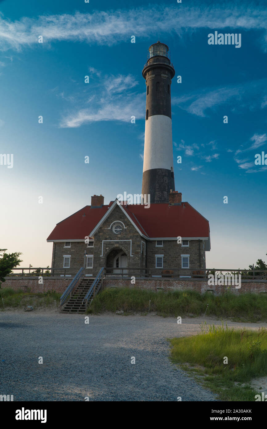 Beautiful shot of a tall lighthouse tower beacon at the shore of the ...