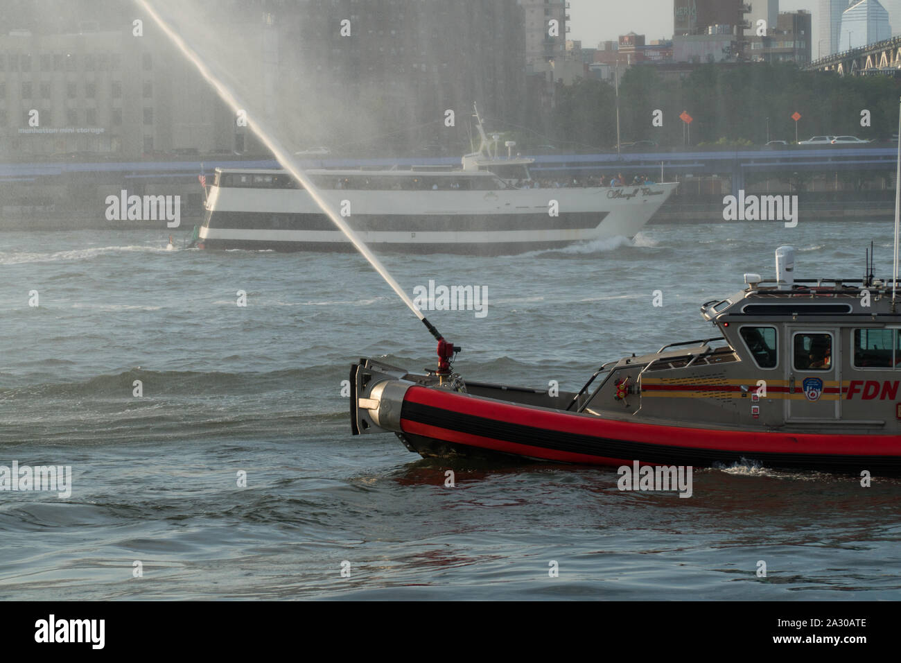 New York City, Circa 2019: FDNY fire boat spraying water from hose used ...