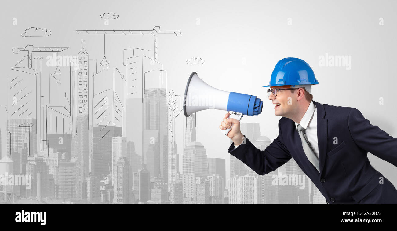 Young supervisor architect yelling to a big city panorama Stock Photo ...