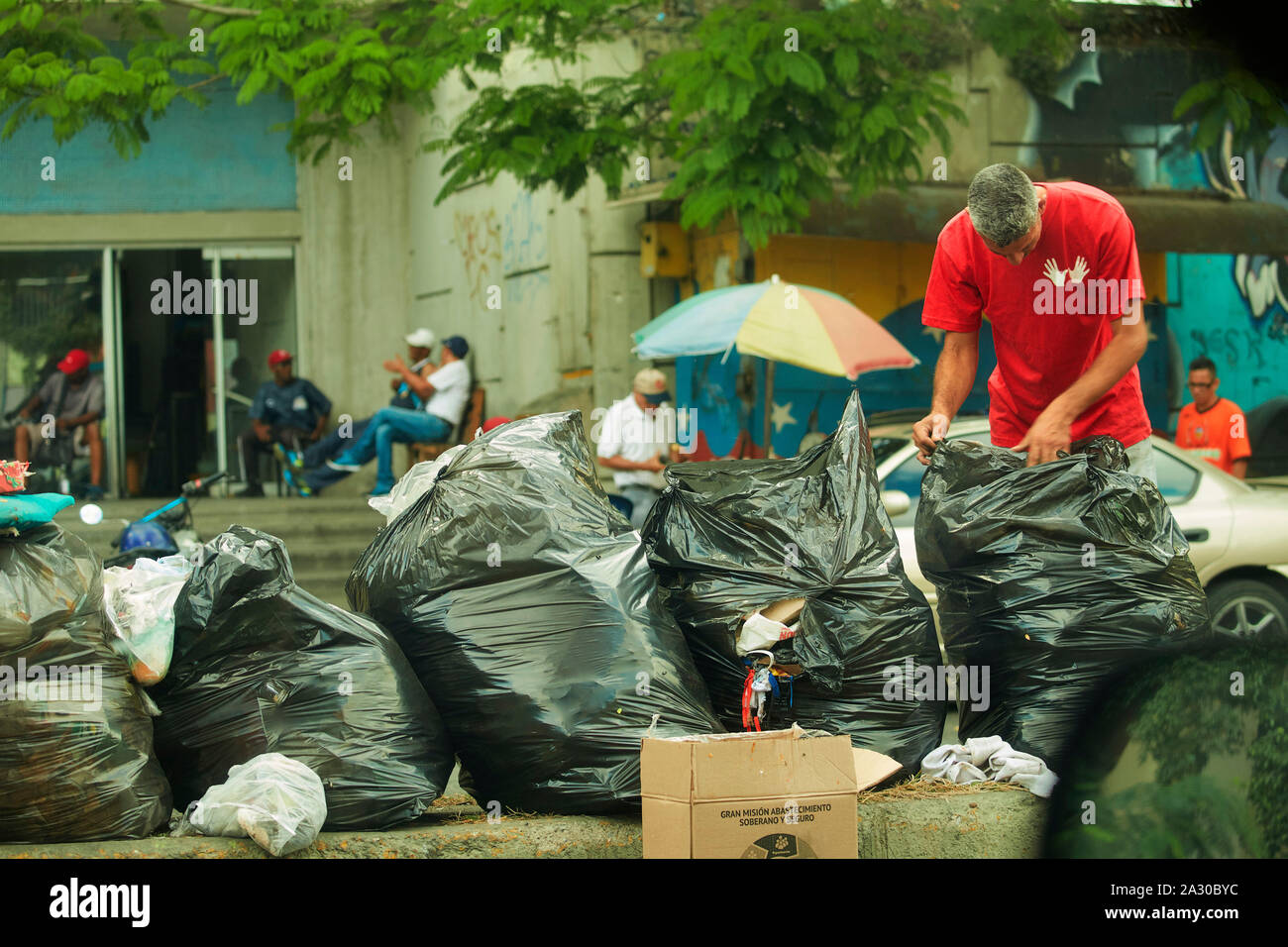 Venezuela Caracas Inspecting Garbage looking for food or other things ...