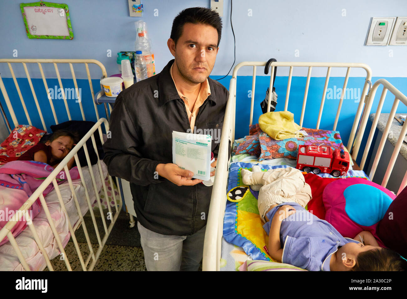 Venezuela Valencia Patient Hugo Malaver (2) with father Oiliver Malaver ...