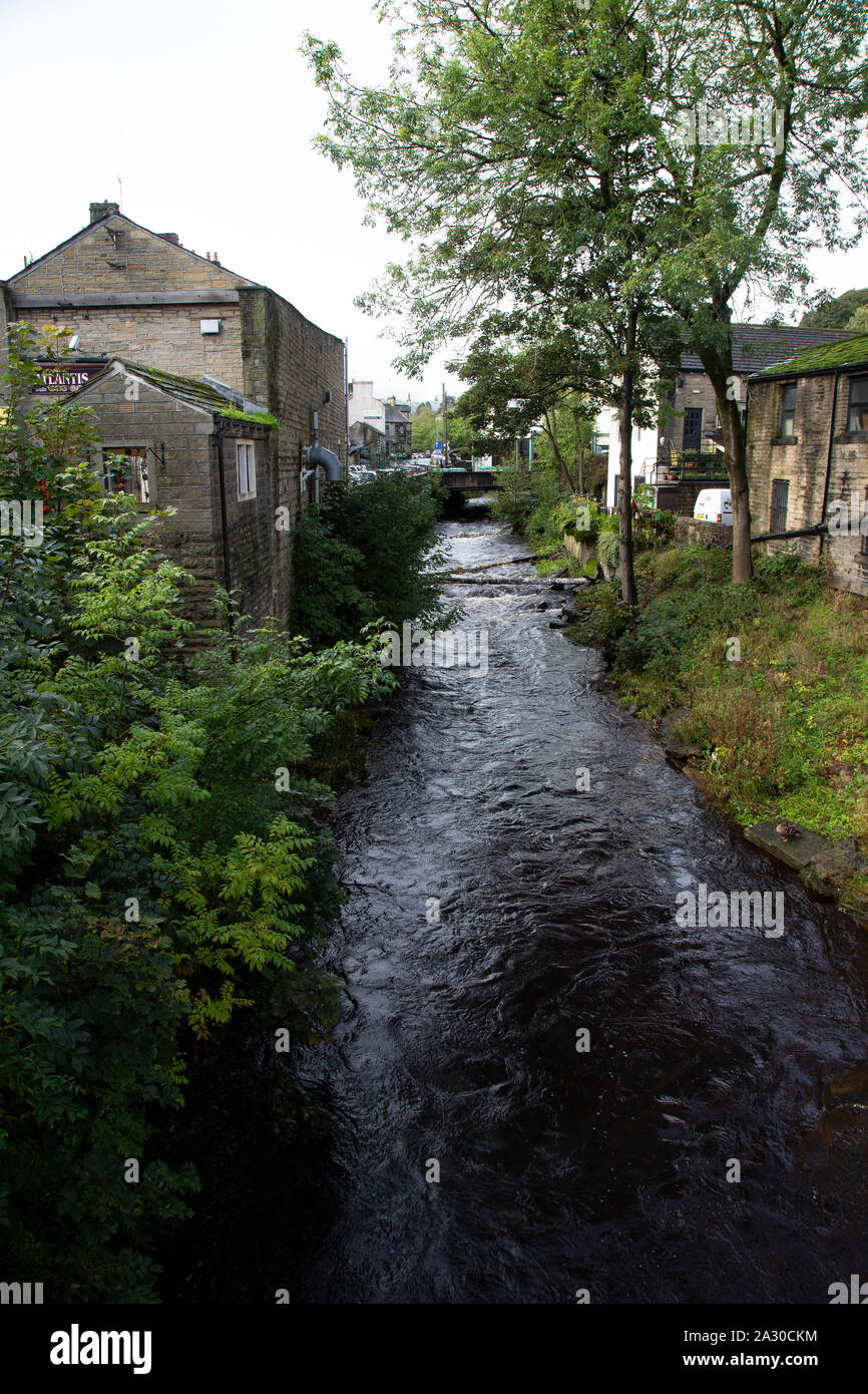 The river Holme flowing through the small town of Holmfirth in West ...