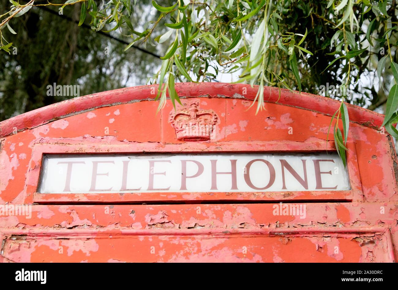 Peeling red paint on a phone box hi-res stock photography and images ...
