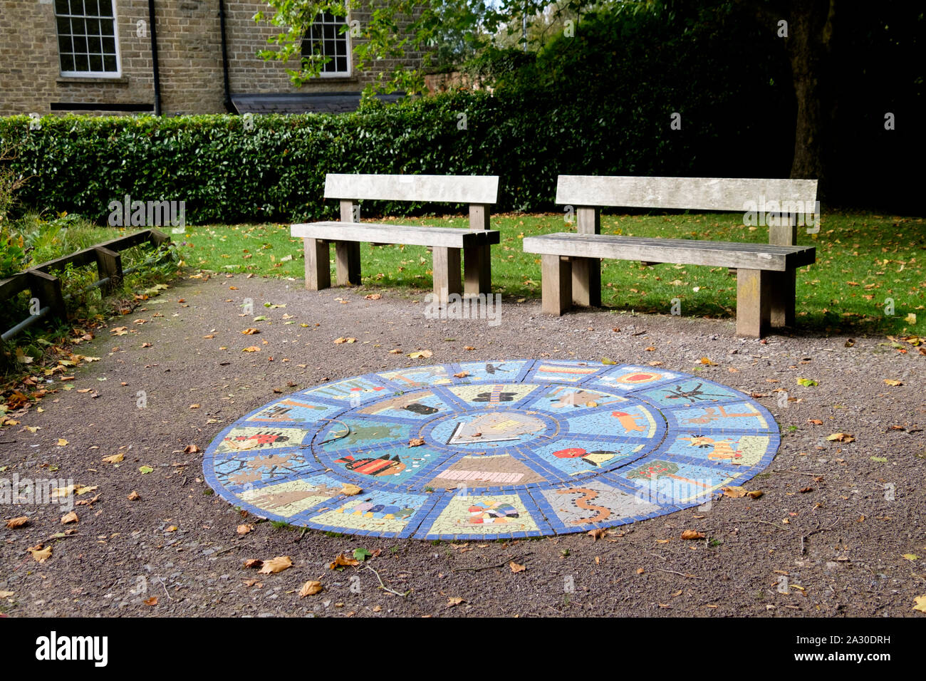 Benches beside a floor mural in Wroughton Wiltshire UK Stock Photo - Alamy