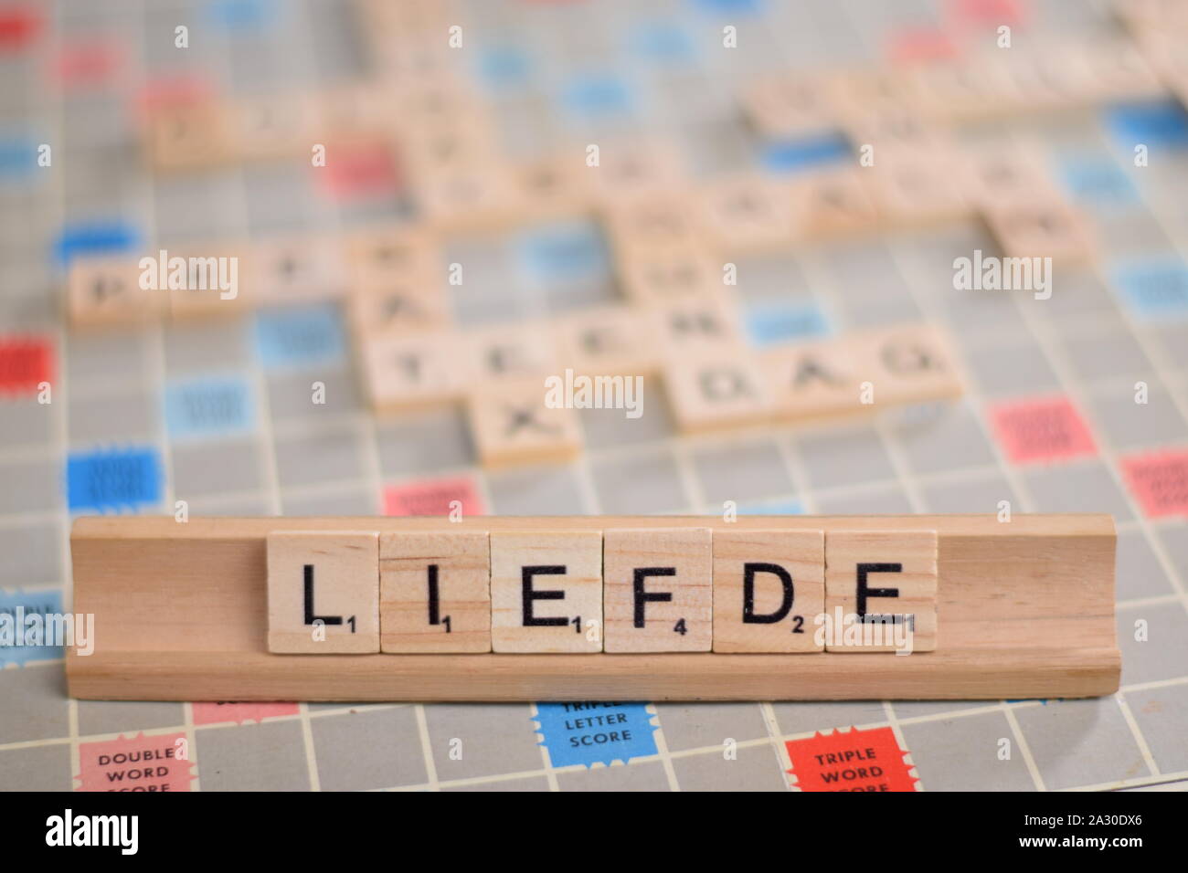 The Dutch word 'liefde' (in English: 'love') in wooden scrabble tiles ...