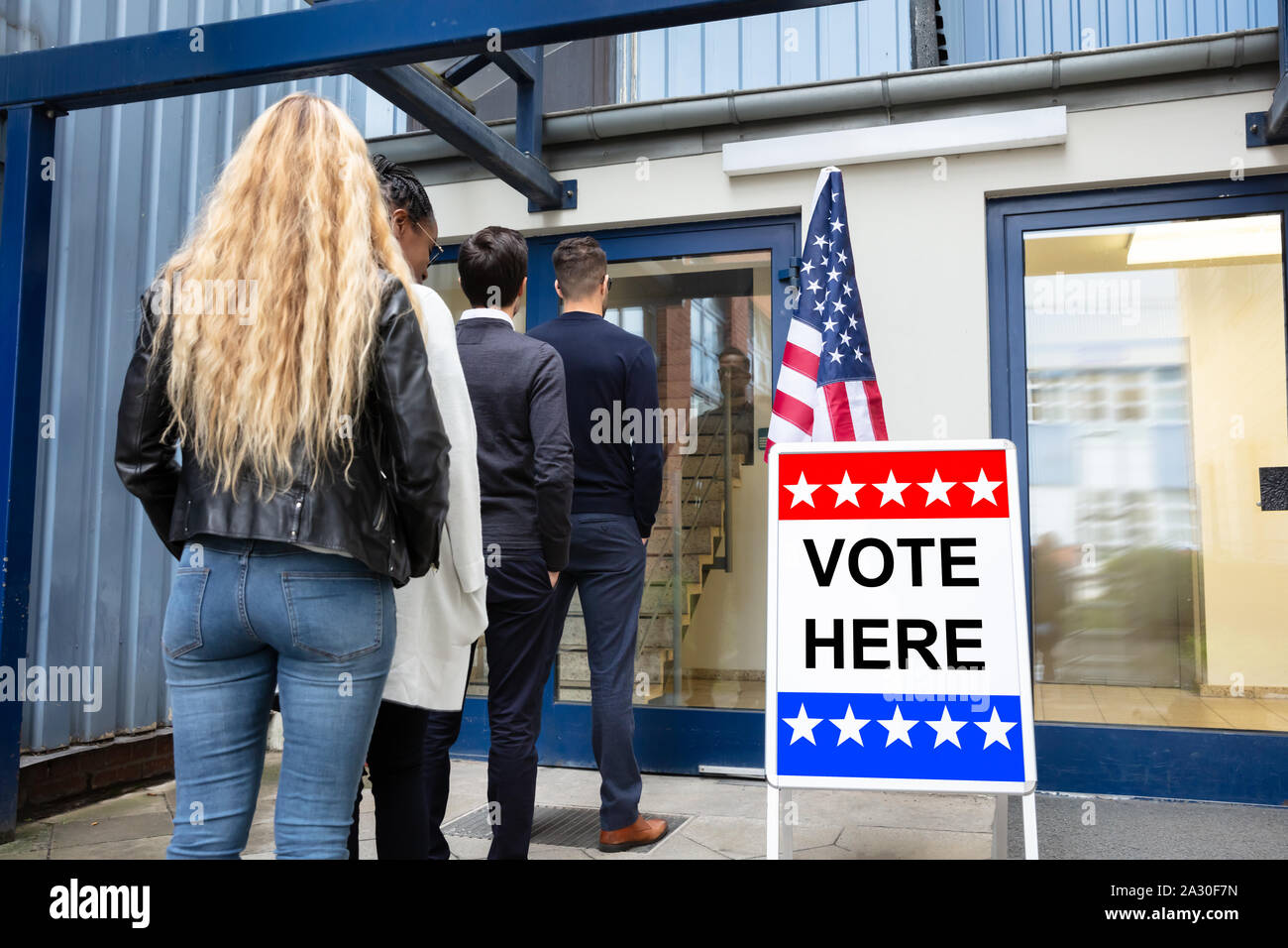 Group Of Young People Standing At The Entrance Of Voting Room Stock ...