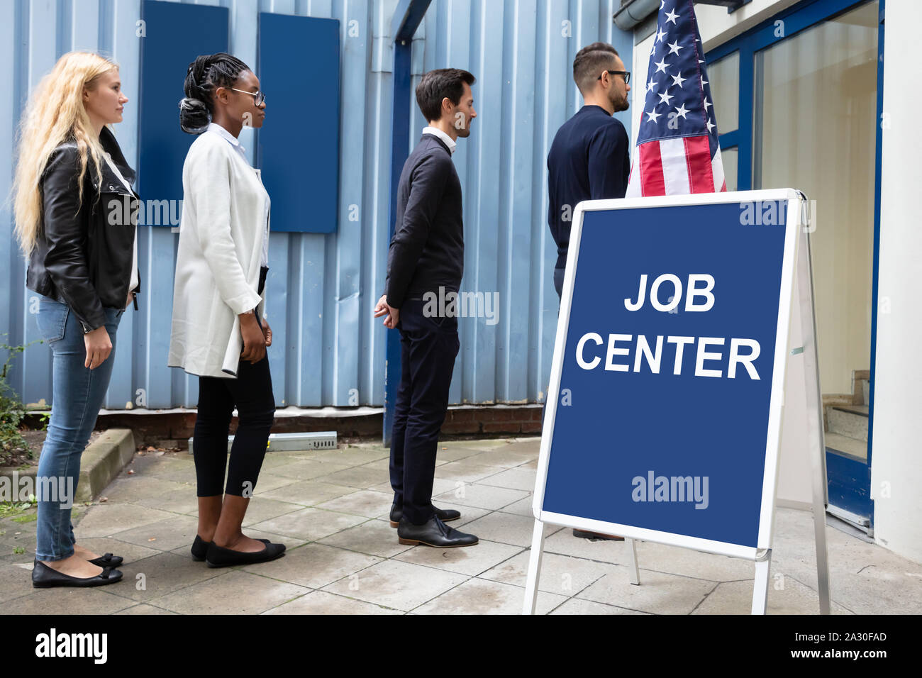 Group Of Businesspeople Standing In Row Outside The Job Center Stock ...