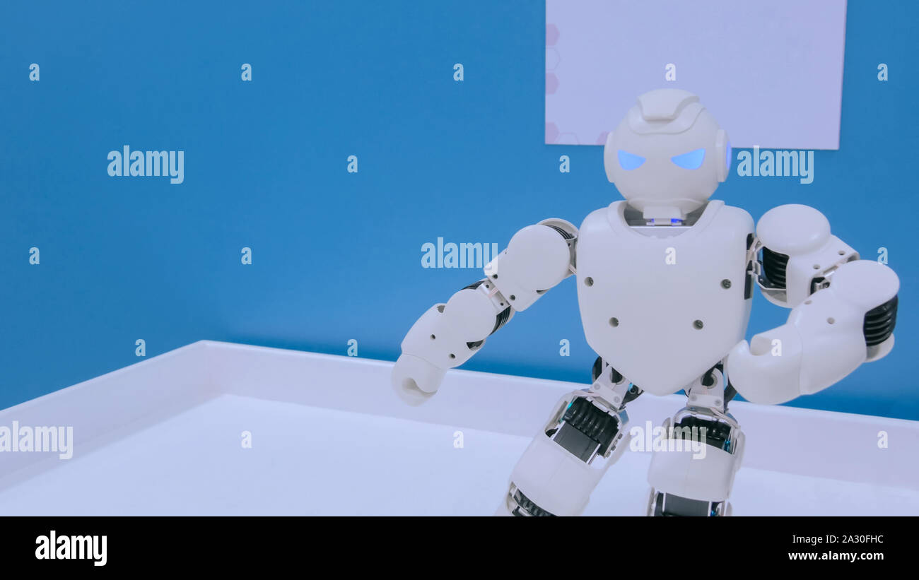 White humanoid robot dancing Stock Photo - Alamy