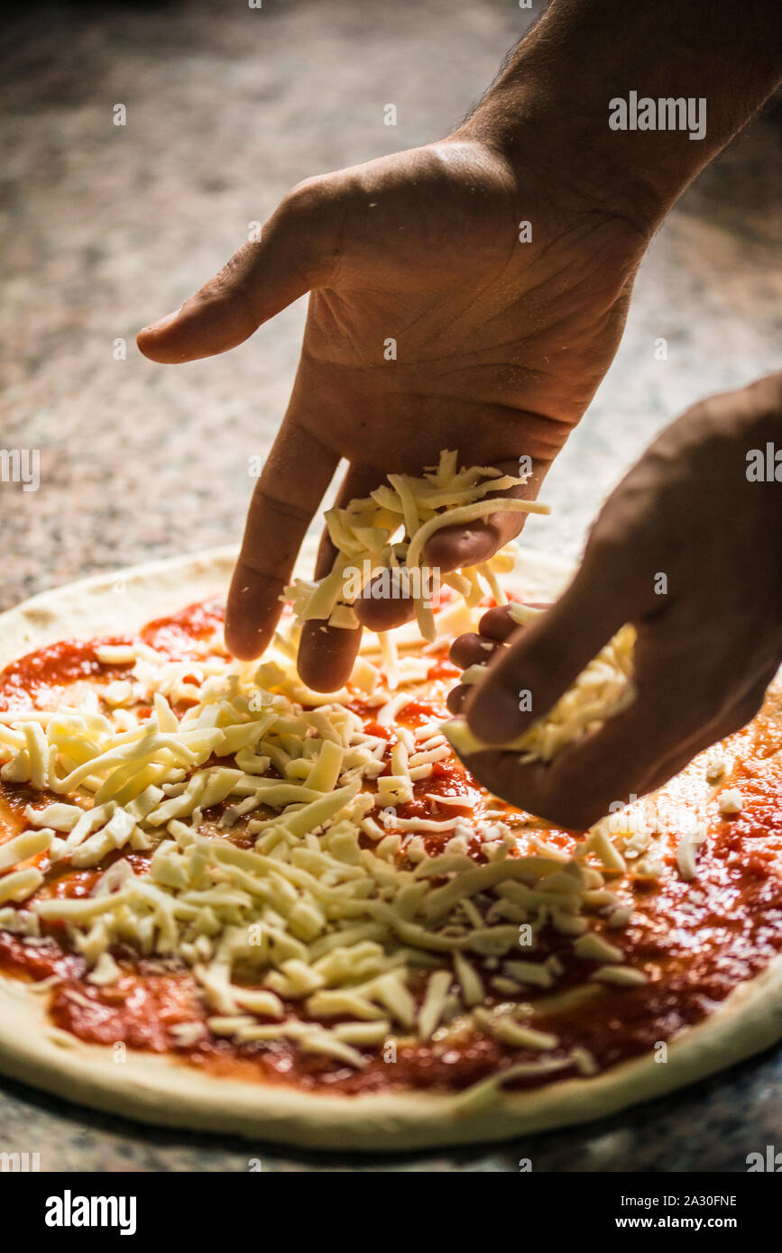 Preparation of traditional italian pizza Stock Photo - Alamy