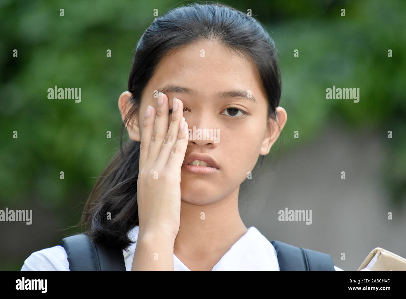 An Unhappy Cute Diverse Female Student Stock Photo - Alamy