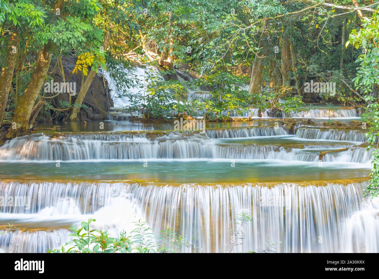 Waterfall flowing from the mountains at Huay Mae khamin waterfall ...