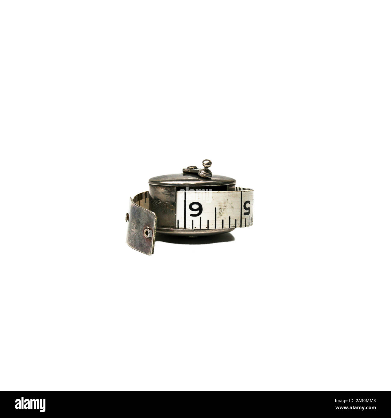 Antique measuring tape in a silver holder Stock Photo - Alamy