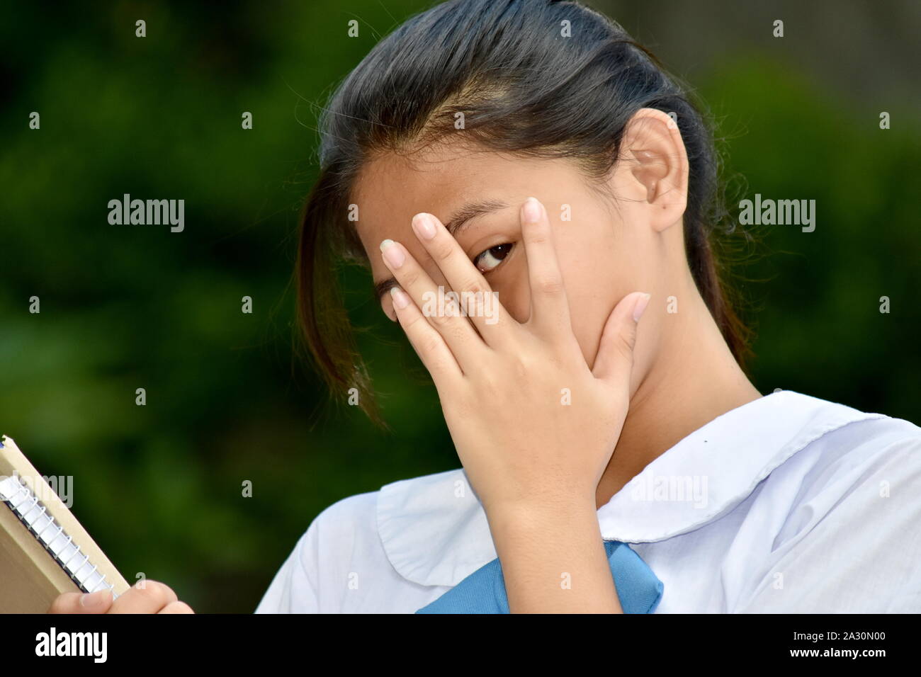 Cute Diverse School Girl And Shyness With School Books Stock Photo - Alamy
