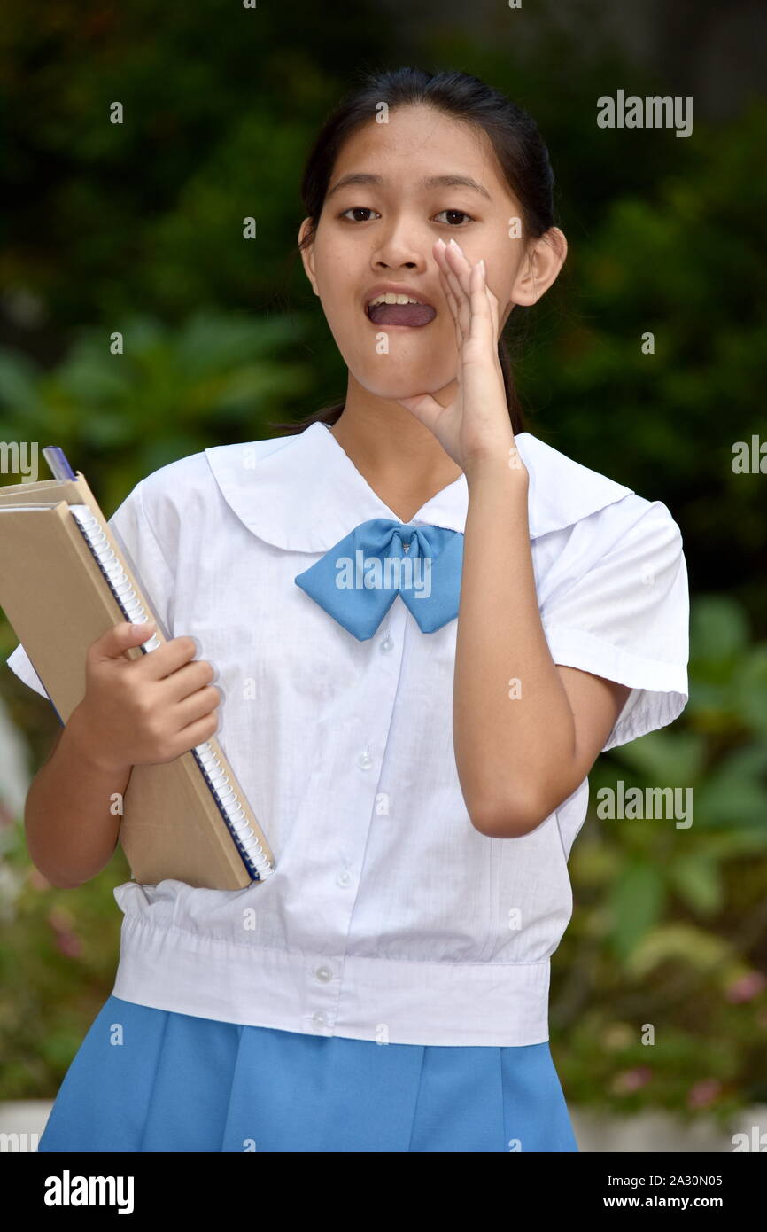 Youthful Filipina Female Student Talking With School Books Stock Photo ...