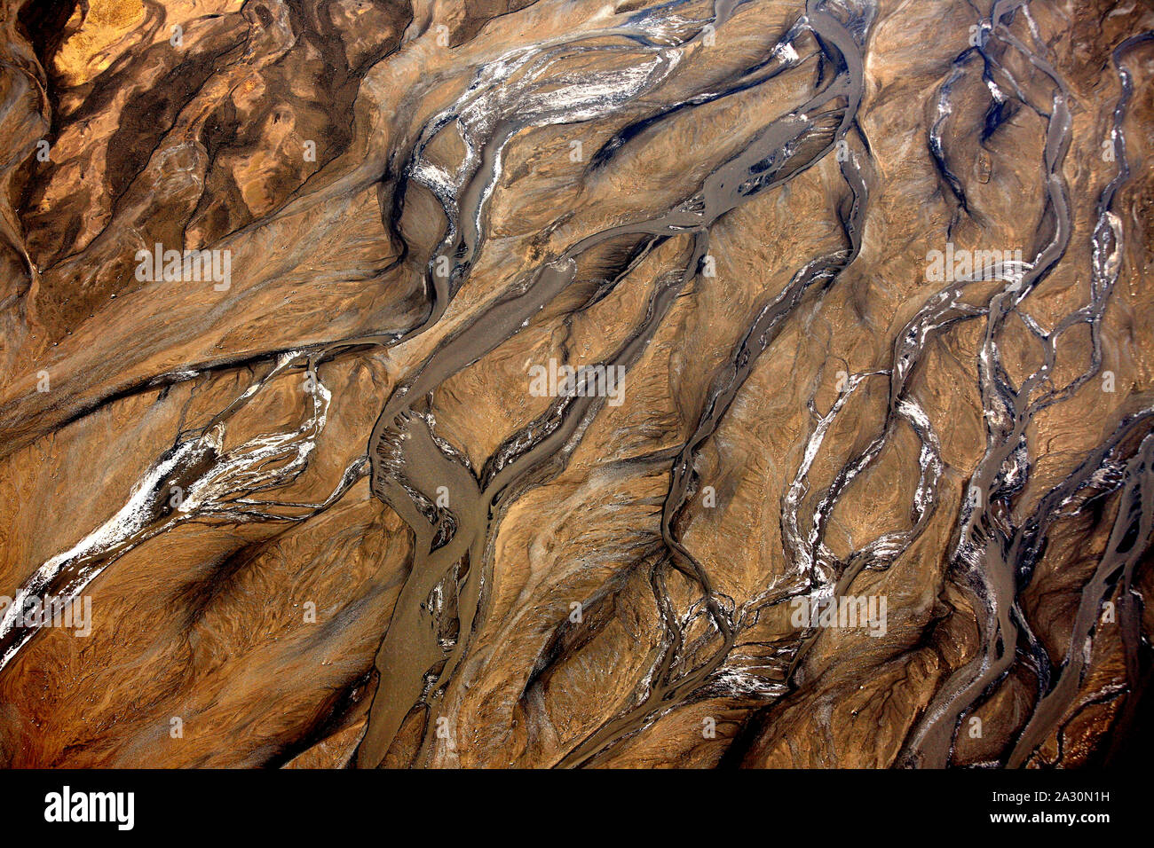 A torrent of water coming from the melting glacieron top of the ...