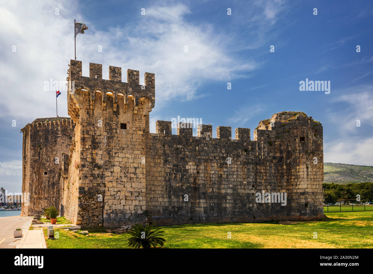 Medieval Kamerlengo fortress of the 15th century with the flag of ...