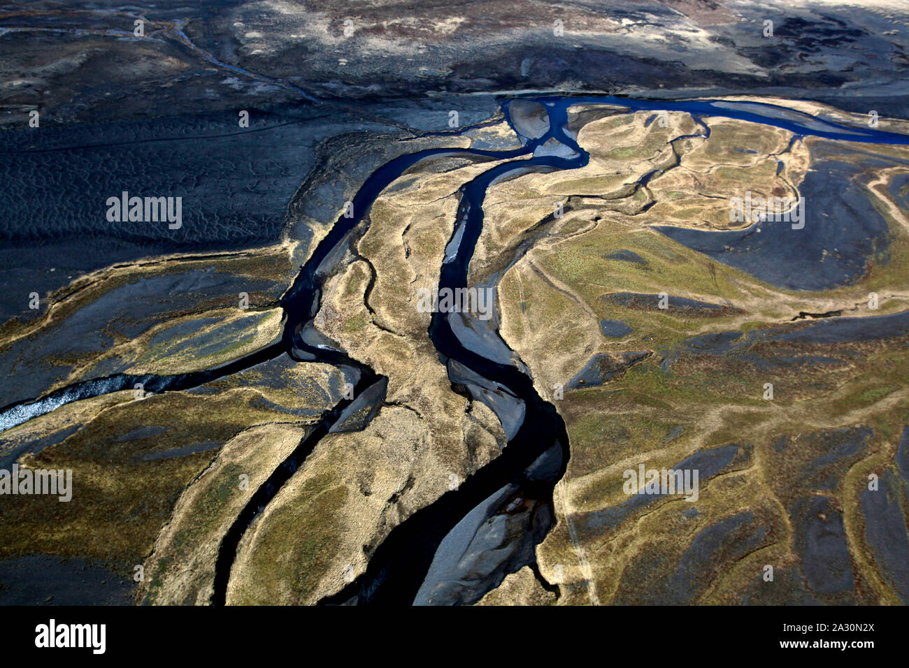 A torrent of water coming from the melting glacieron top of the ...