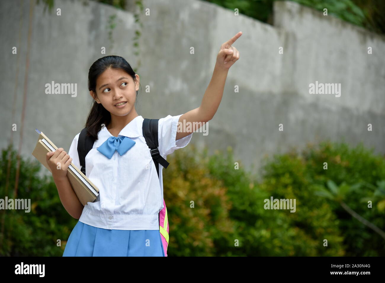An A Pointing Diverse Girl Student Stock Photo - Alamy