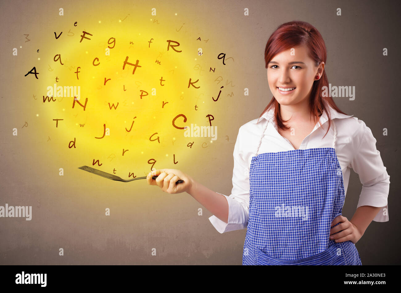 Young person cooking letters in wok Stock Photo - Alamy
