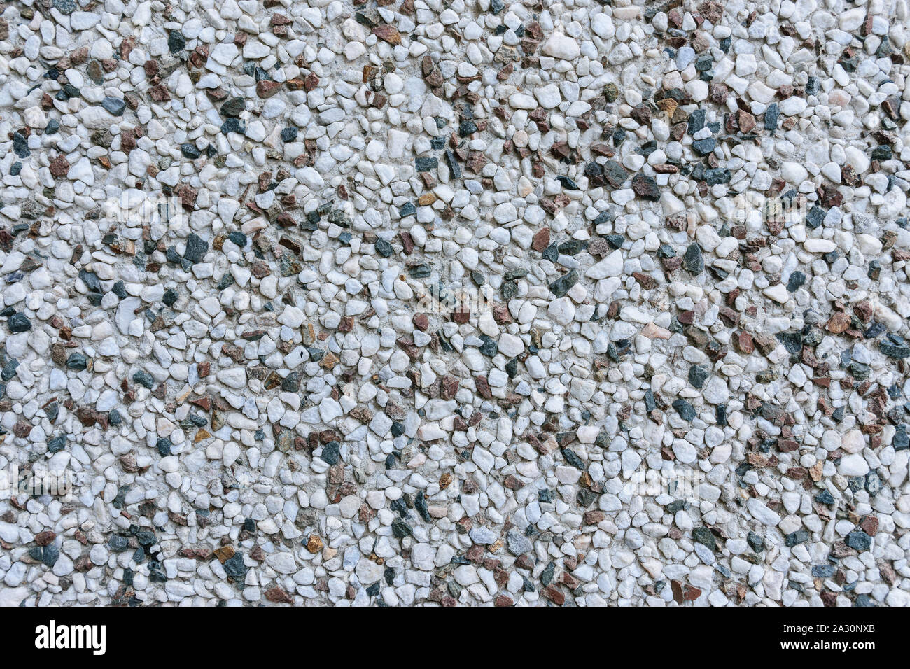 Wall with small stones as texture background Stock Photo - Alamy
